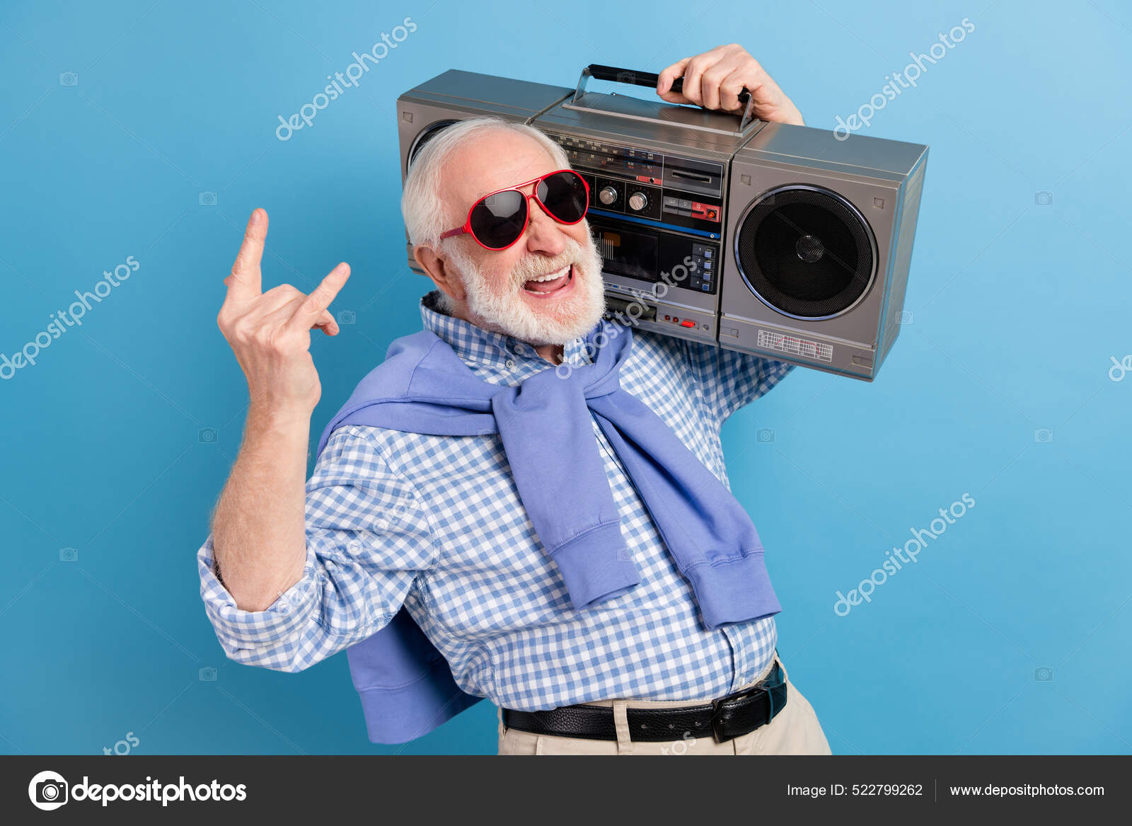 Photo of optimistic old grey hairdo man show rock sign hold boom-box ...