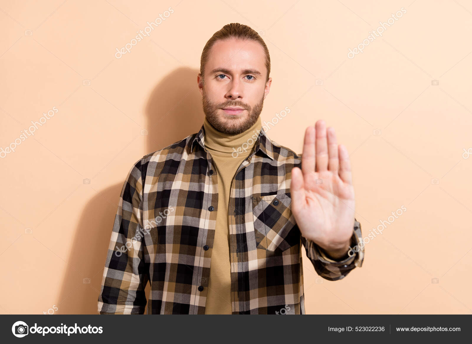 Photo of young handsome guy show arm stop ban denial symbol reject ...