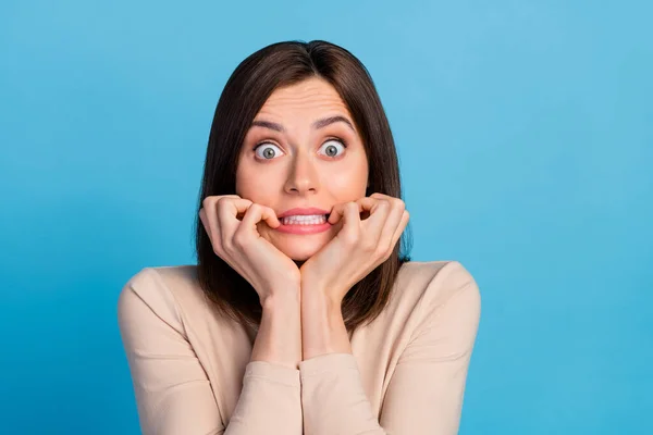 Portrait of impressed scared lady teeth biting finger nail staring ...