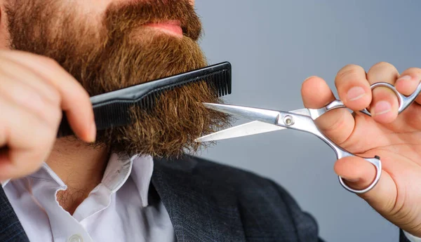 Barbershop. Bearded man with scissor and comb. Barber tools ...