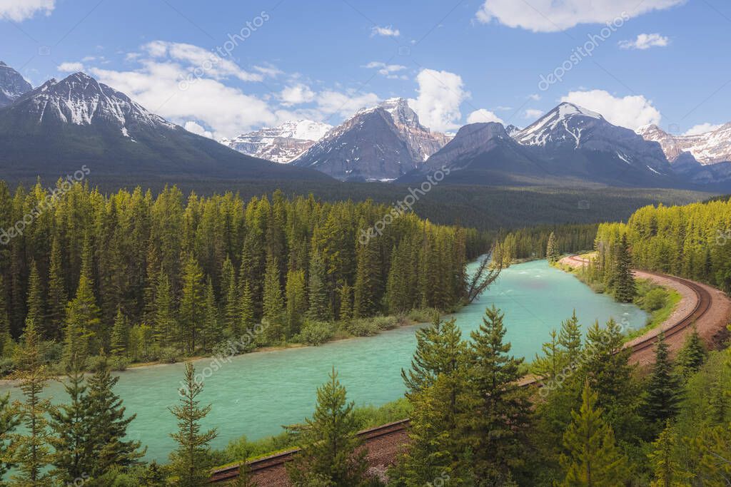 Scenic landscape view of railway train tracks and the Bow River at ...