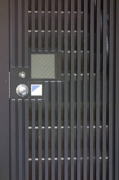 Solid metal door with security measures - Stock Image - Everypixel