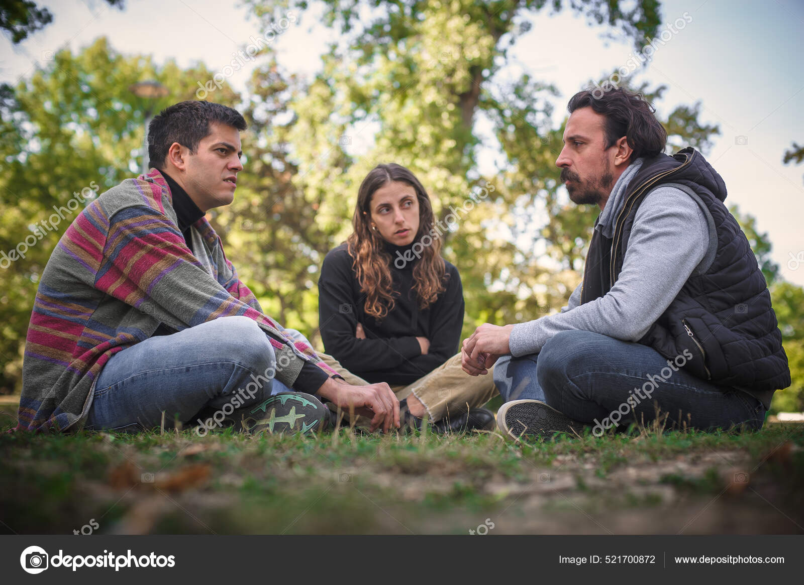 Three Worried Friends Two Men Girl Sit Together Ground Public Stock ...