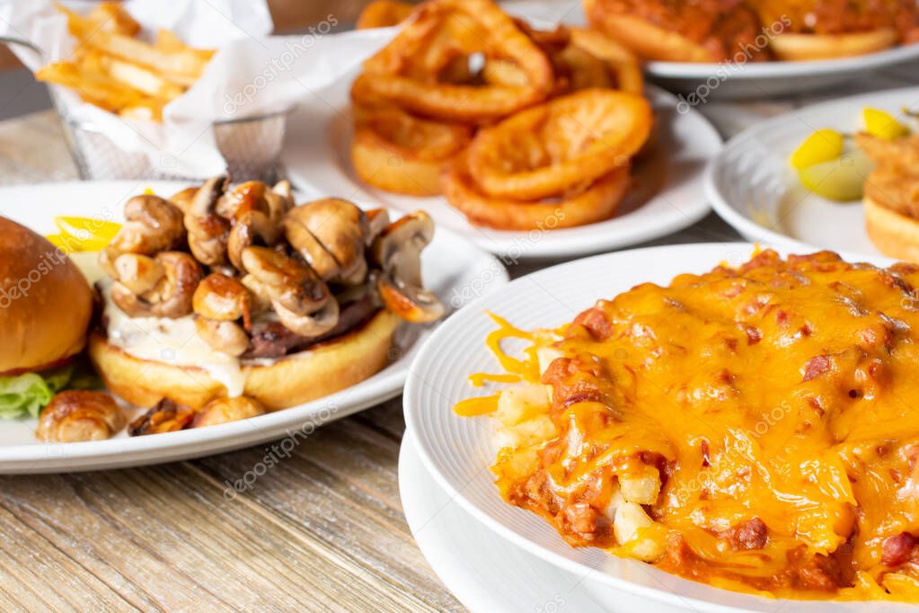 A view of several savory entrees, in a diner restaurant setting ...