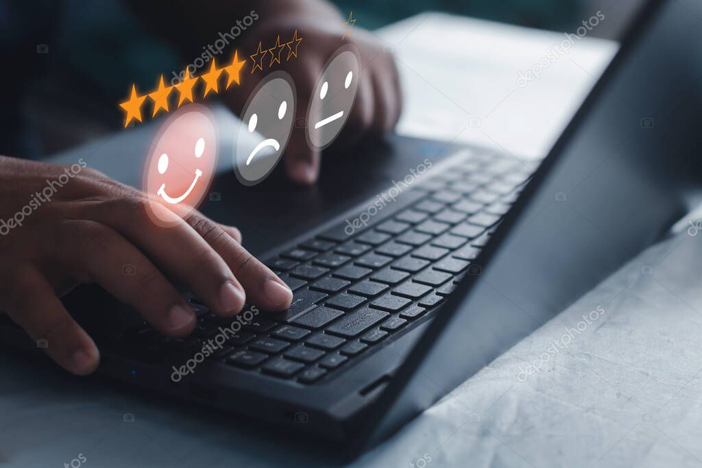 Businessman using laptop computer satisfaction survey and evaluation ...