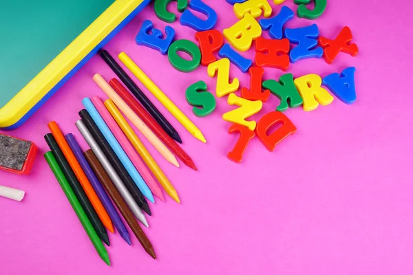 English alphabet letters, colorful pencils and childish school ...