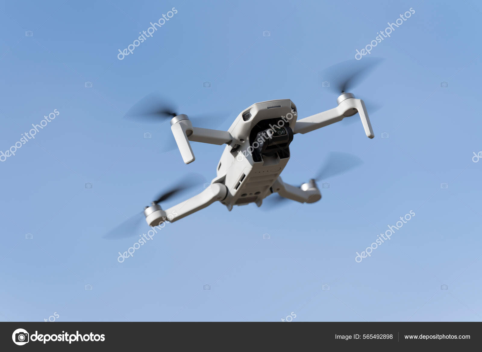 Drone flying with the light blue sky on the background — Stock Photo ...