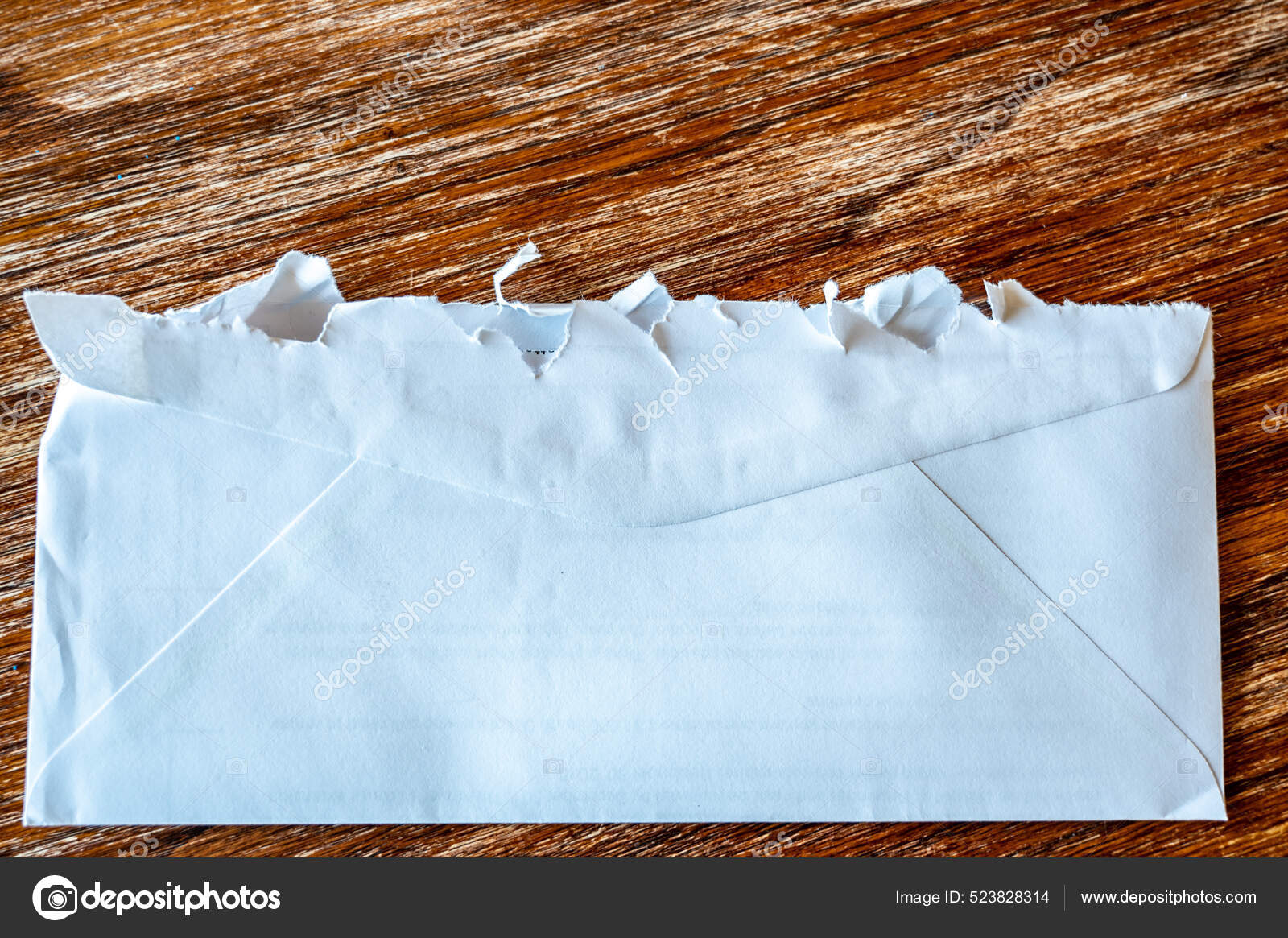 Selective focus on jagged edges of a ripped open mail envelope — Stock ...