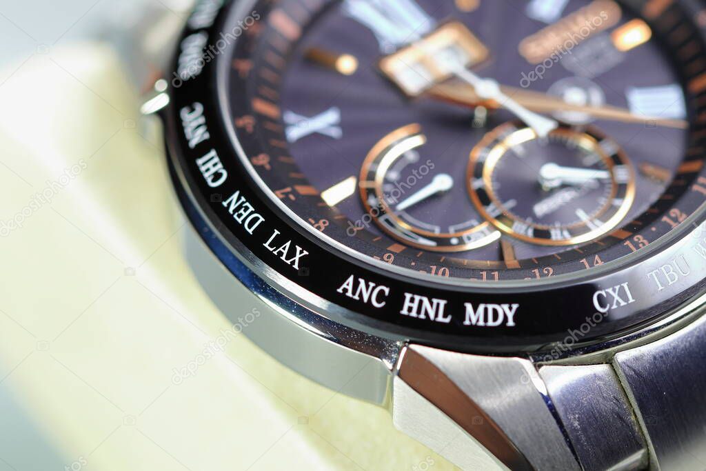 close up shallow focus Time zone cities code on luxury world time watch bezel on DEN Denver, LAX ...