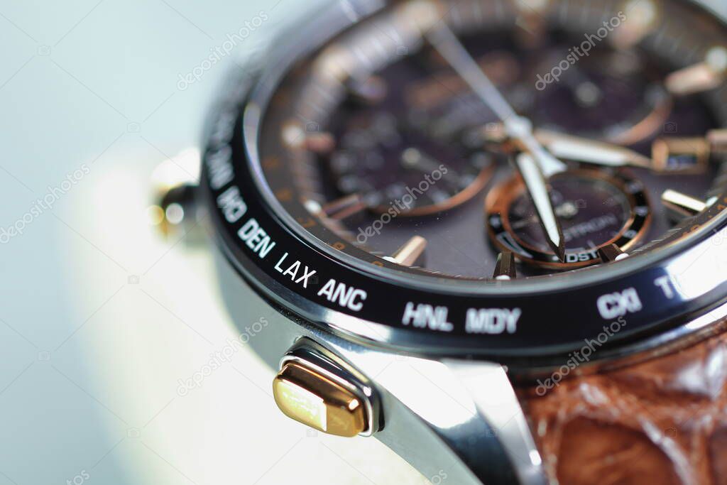 close up shallow focus Time zone cities code on luxury world time watch ...