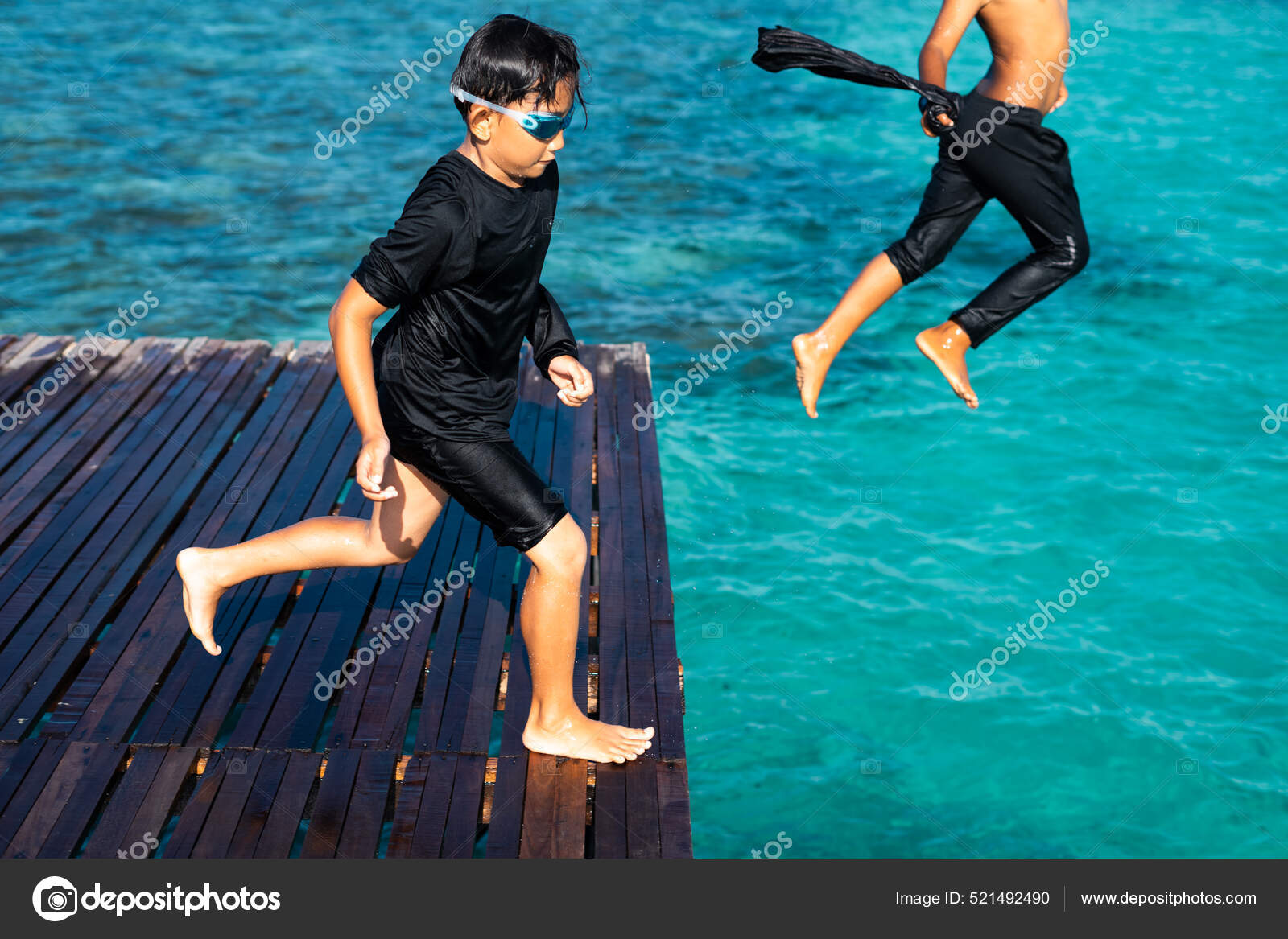 Kids Jumping Water Wooden Pier — Stock Photo © ellinnur #521492490