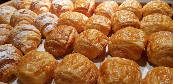 Assorted fresh baked sweet puff pastry stuffed with fruit and jelly and ...