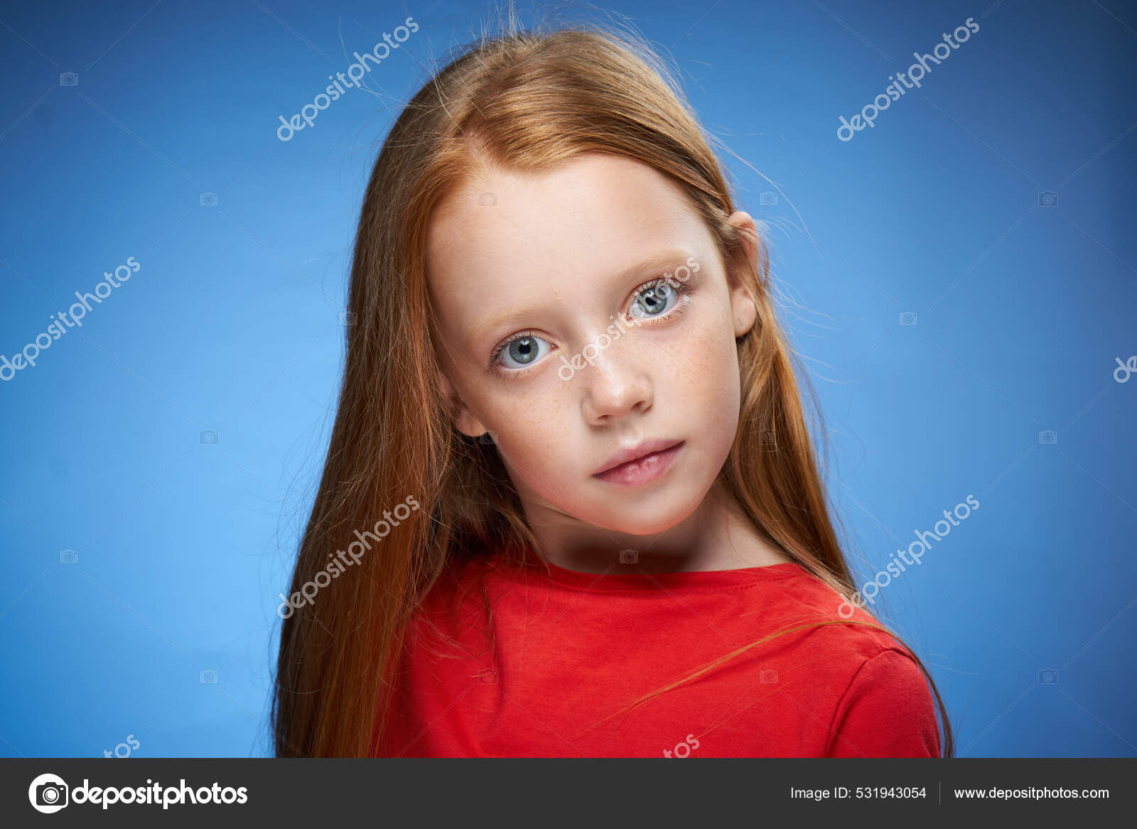 Cute red-haired girl in red t-shirt emotions blue background — Stock ...