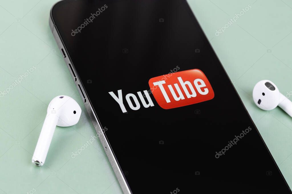 YouTube mobile logo app on screen smartphone iPhone closeup with ...