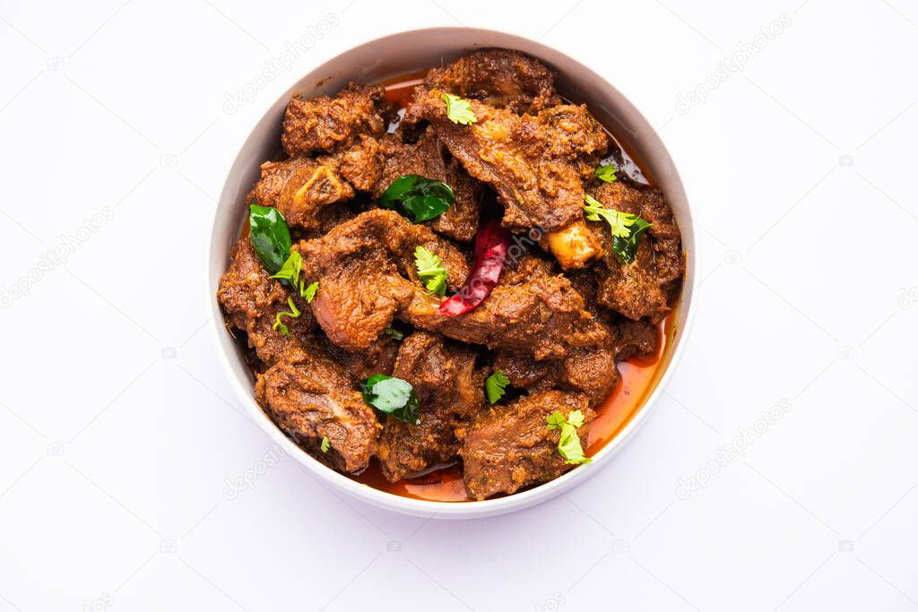 Sukha mutton or chicken, dry spicy Murgh or goat meat served in a plate ...