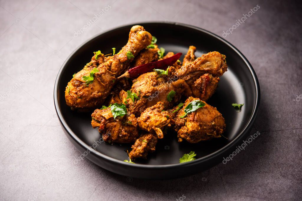 Sukha mutton or chicken, dry spicy Murgh or goat meat served in a plate ...