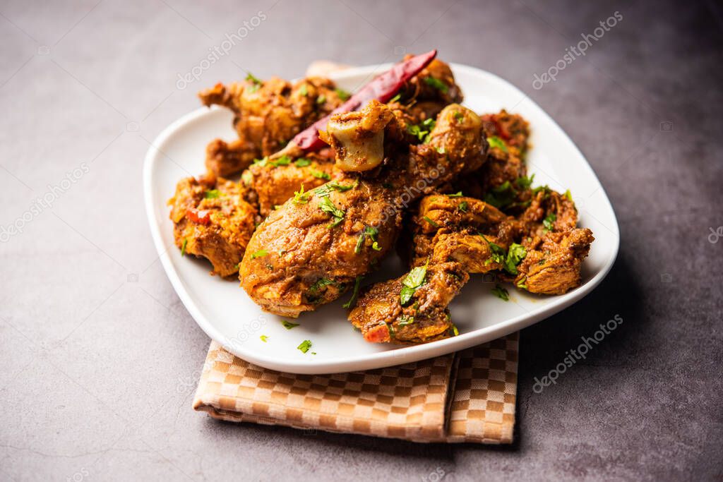 Sukha mutton or chicken, dry spicy Murgh or goat meat served in a plate ...