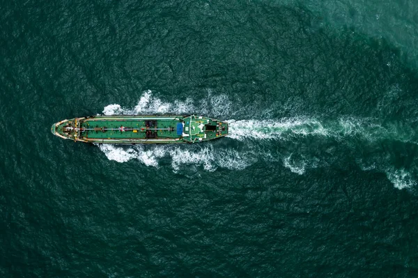 Aerial top view Oil ship tanker sailing full speed with wave and splash ...