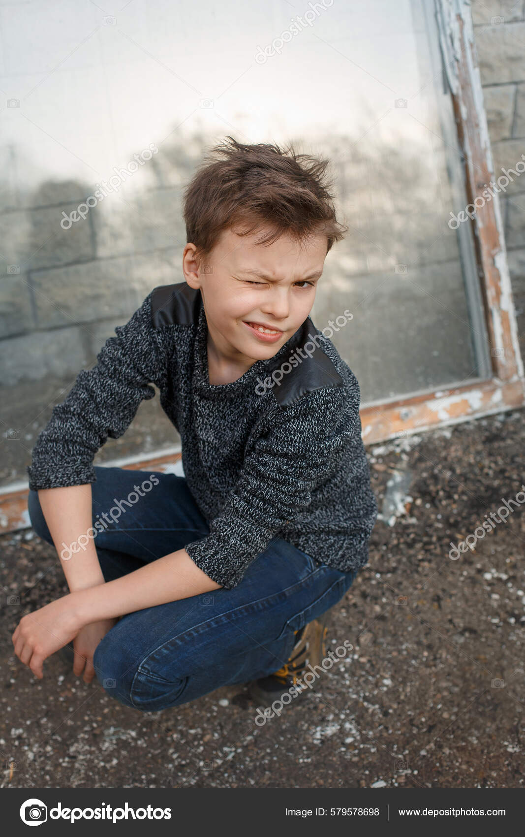 Sad Boy Squatting Squinting Next Wall Furrowed Brow Kid Thoughtful ...