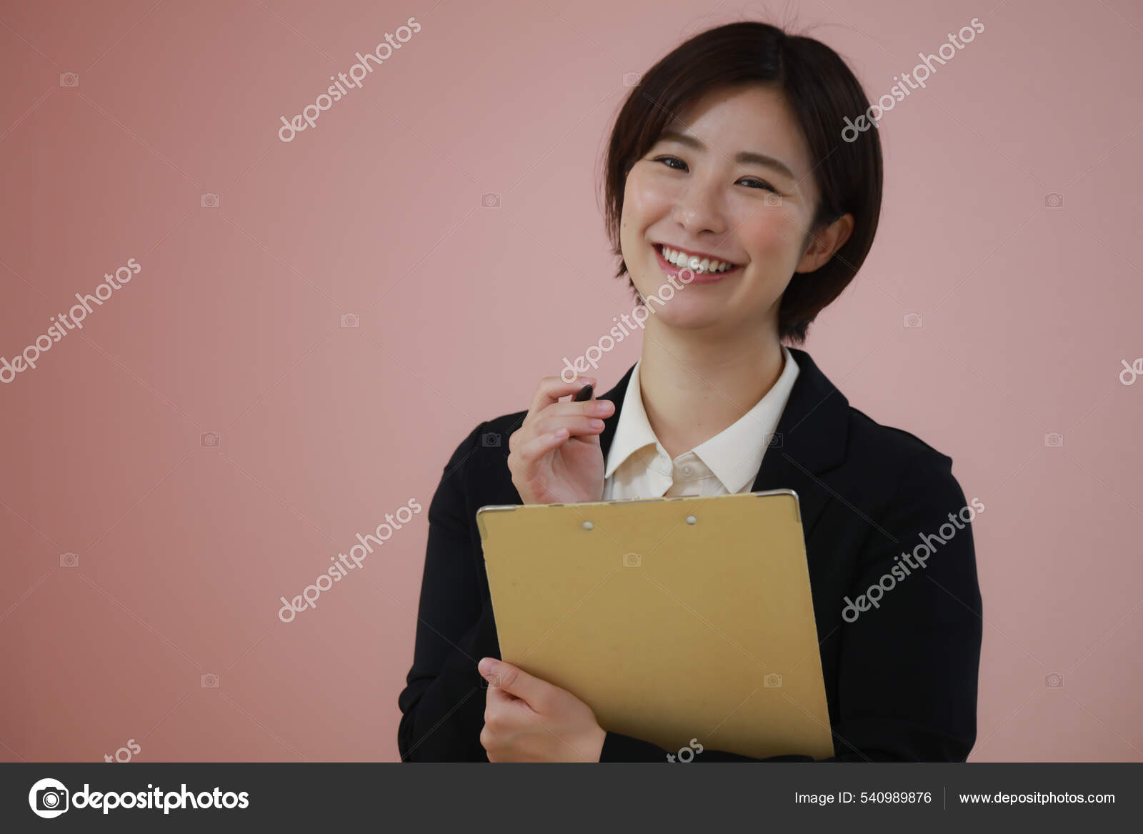 Female Employee Binder Stock Photo by ©yamasan 540989876