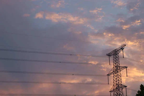 high voltage power lines in the sky - Stock Image - Everypixel