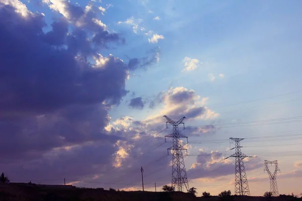 high voltage power lines in the sky - Stock Image - Everypixel