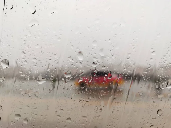 rain drops on window glass, rainy weather - Stock Image - Everypixel