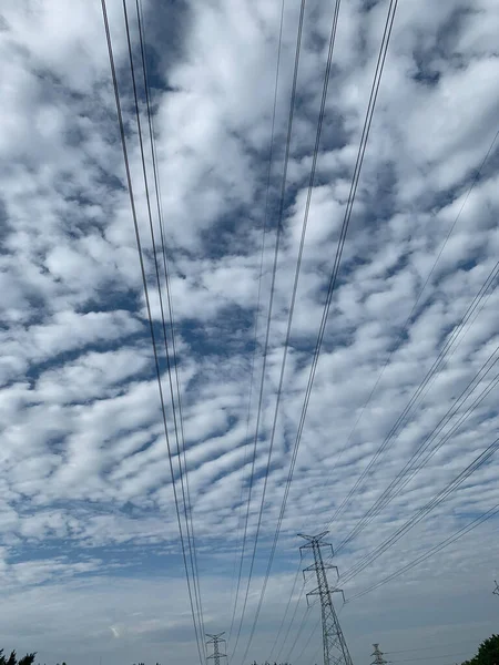 high voltage power lines in the sky - Stock Image - Everypixel