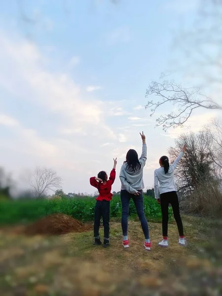 young couple in love jumping in the park - Stock Image - Everypixel