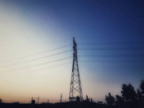 high voltage power lines in the sky - Stock Image - Everypixel