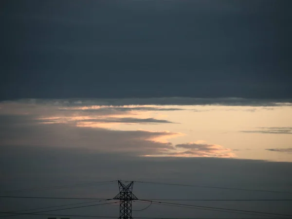 high voltage power lines in the sky - Stock Image - Everypixel