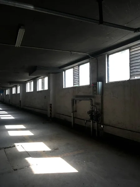 empty parking garage with dark concrete floor and grunge background ...