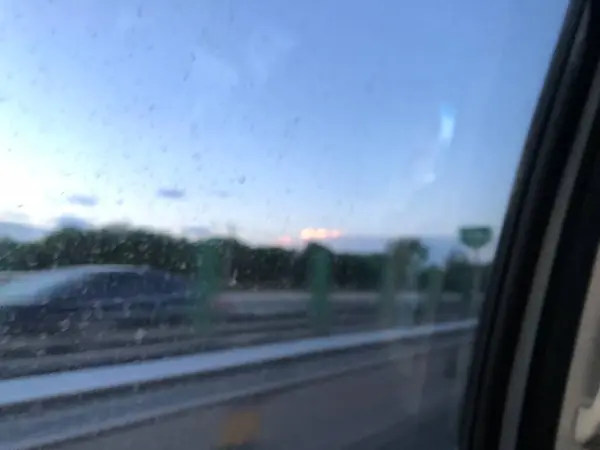 car window with blurred background - Stock Image - Everypixel