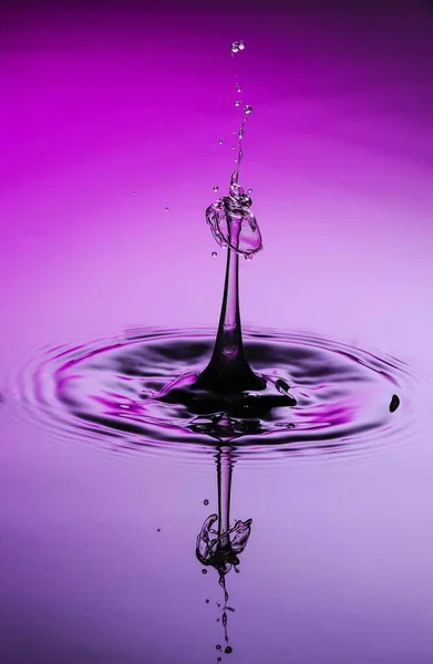 water drop falling into the liquid - Stock Image - Everypixel