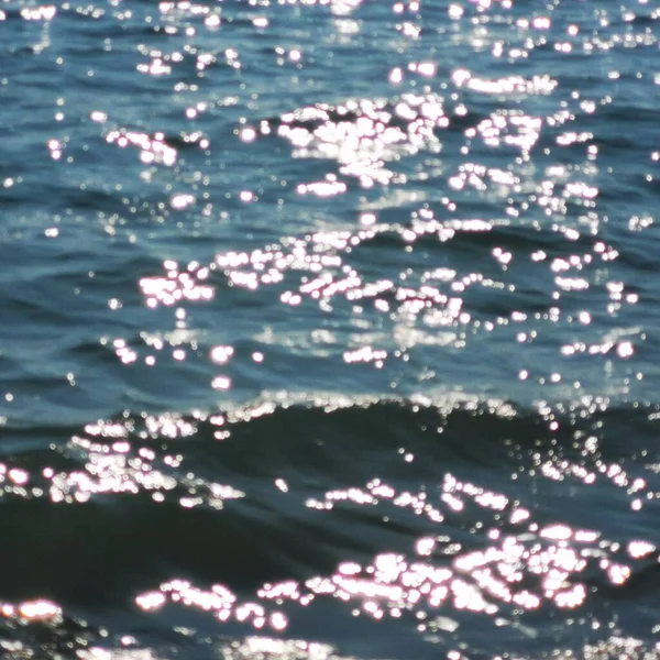 sea water with waves and sun reflections - Stock Image - Everypixel