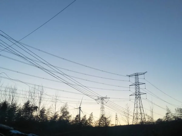 high voltage power lines in the sky - Stock Image - Everypixel