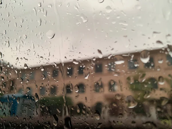 rain drops on glass window, rainy weather - Stock Image - Everypixel