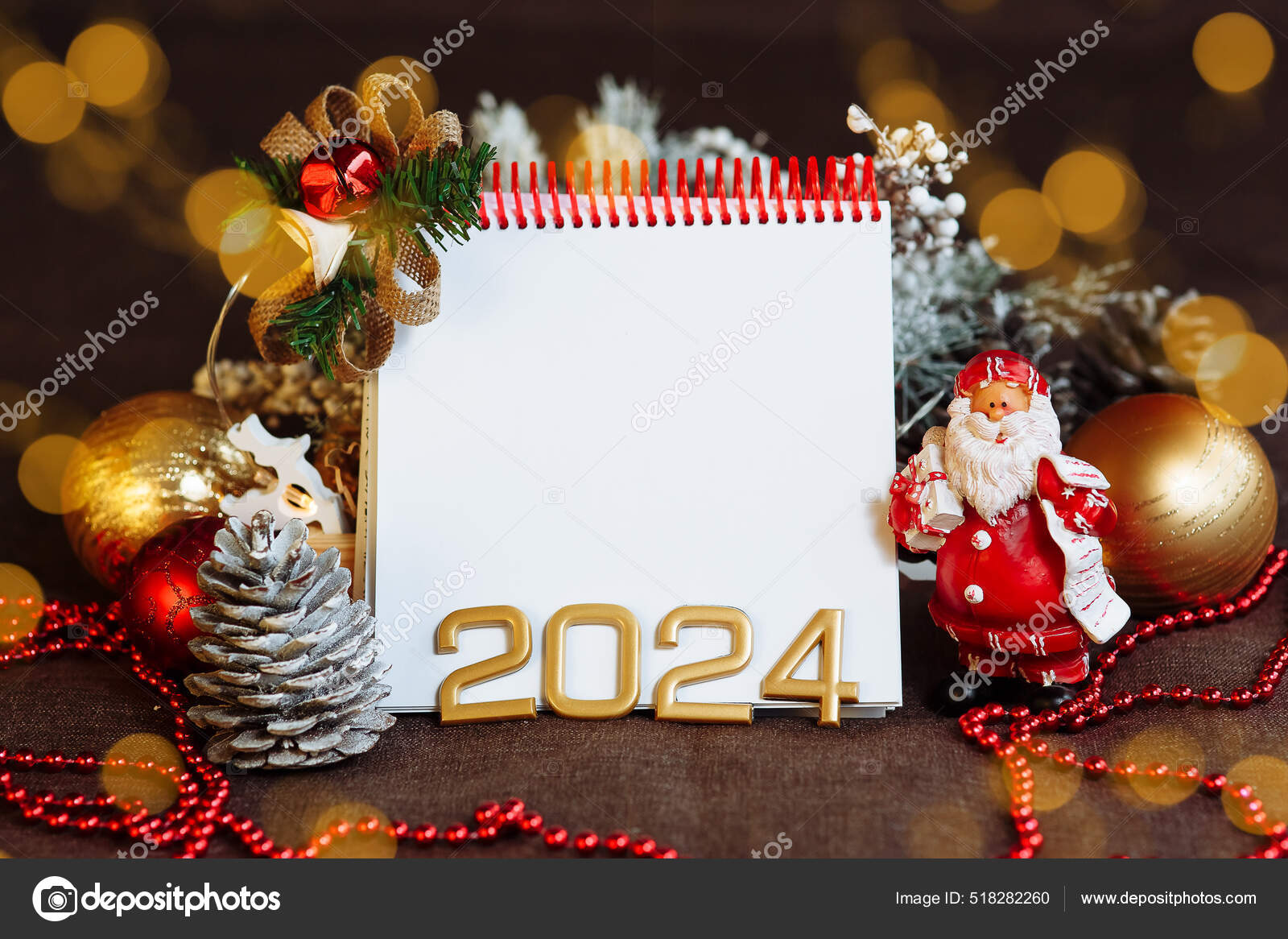Notepad with 2024 a space for text among Christmas decorations ...