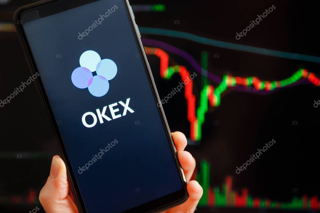 Ukraine, Odessa - September, 7 2021: OKEx mobile app running at smartphone screen with trading ...