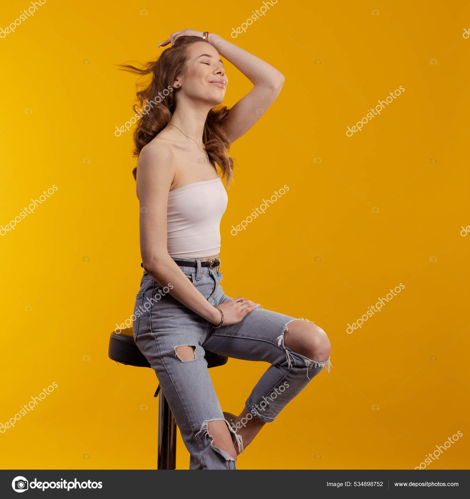 Beautiful Sexy Woman Ripped Jeans High Heels Posing Camera Yellow Stock