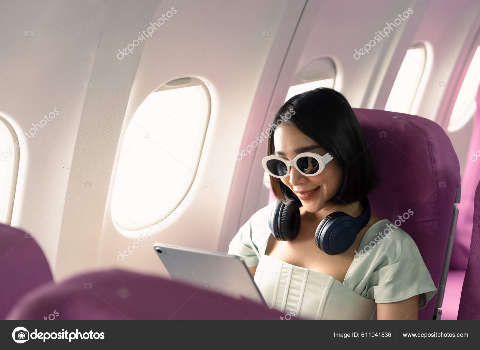 Passenger Using Tablet Computer Airplane Cabin Flight Watching Series ...