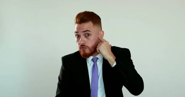 Upset man arguing to camera. Angry business man talking to camera ...