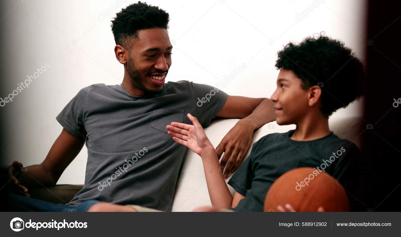 Older Brother Teaching Younger Sibling Spin Basketball Finger Two ...