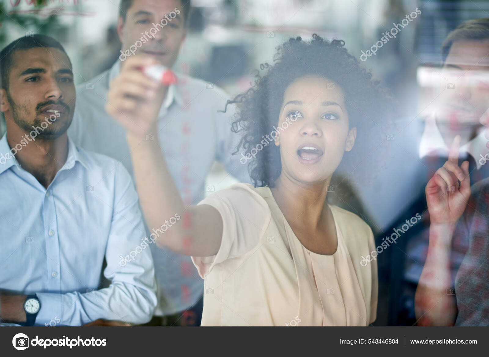 Helping them to visualize her thought process. Shot of a group of ...
