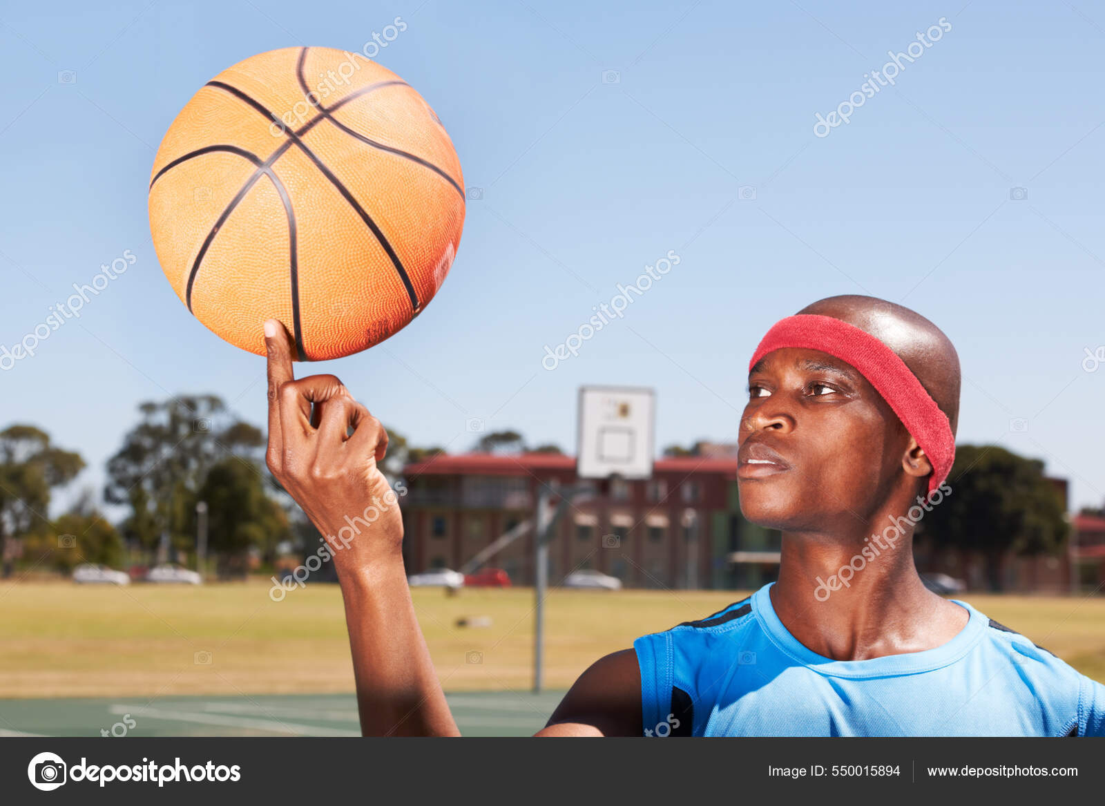 Its all about balance. A young sportsman balancing a basketball ...