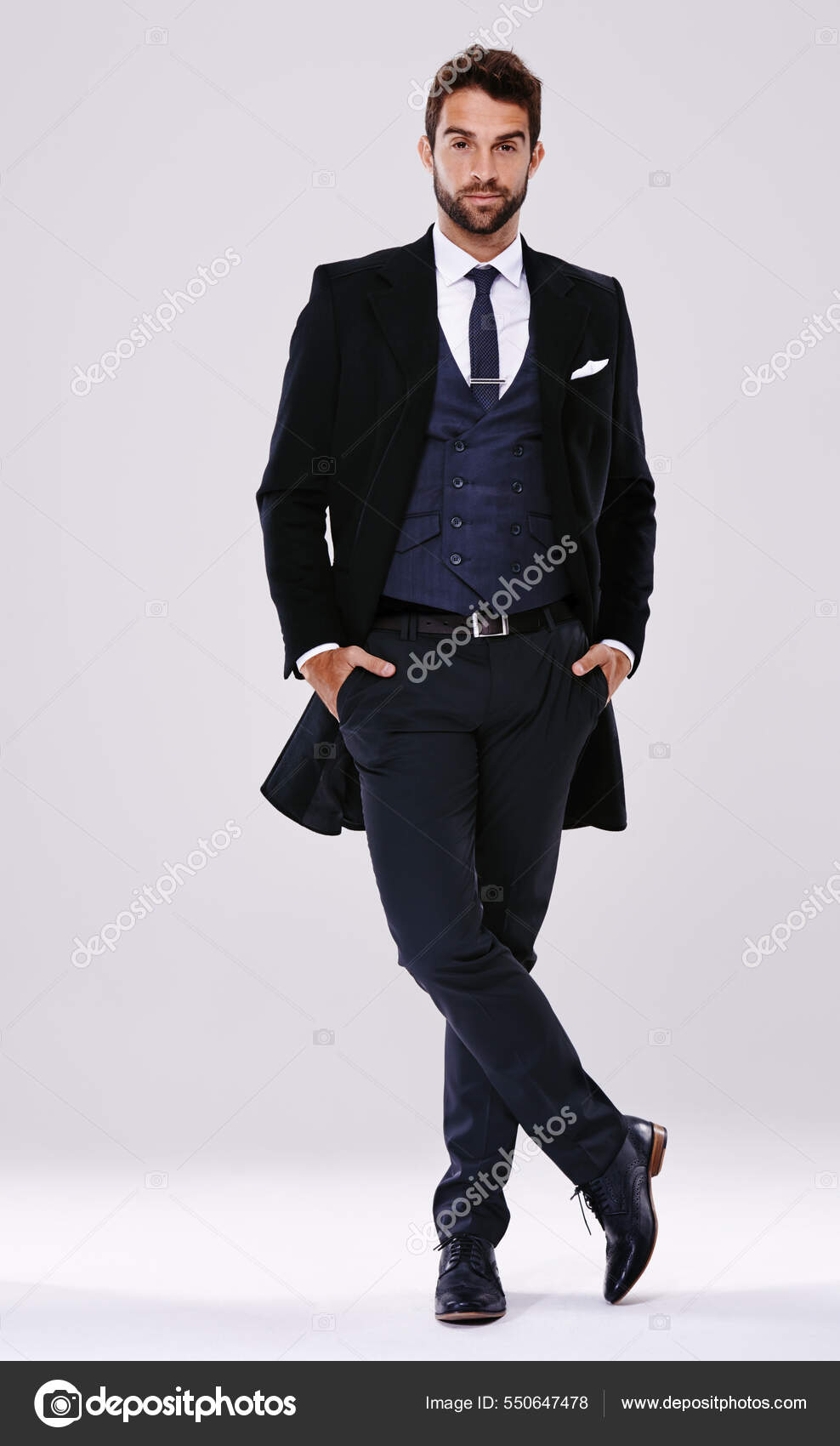 Handsome and successful. Studio shot of a well-dressed man against a ...