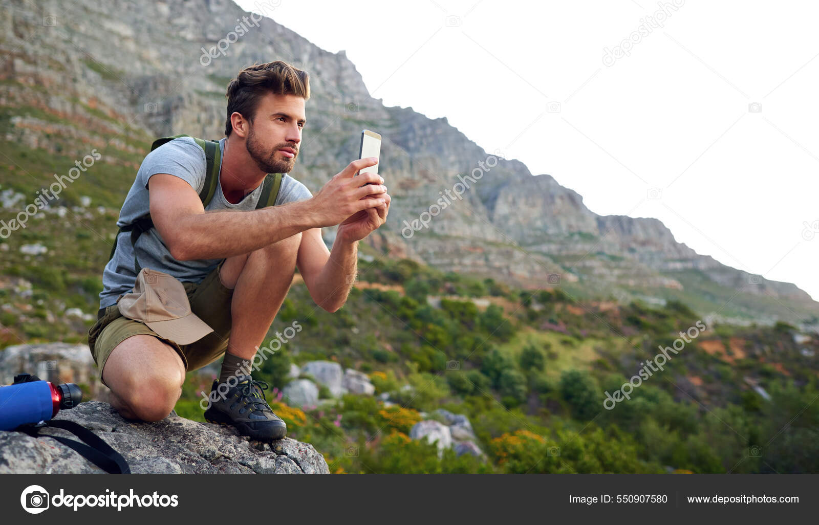 Ive gotta get some pics. Shot of a handsome young man snapping pics ...