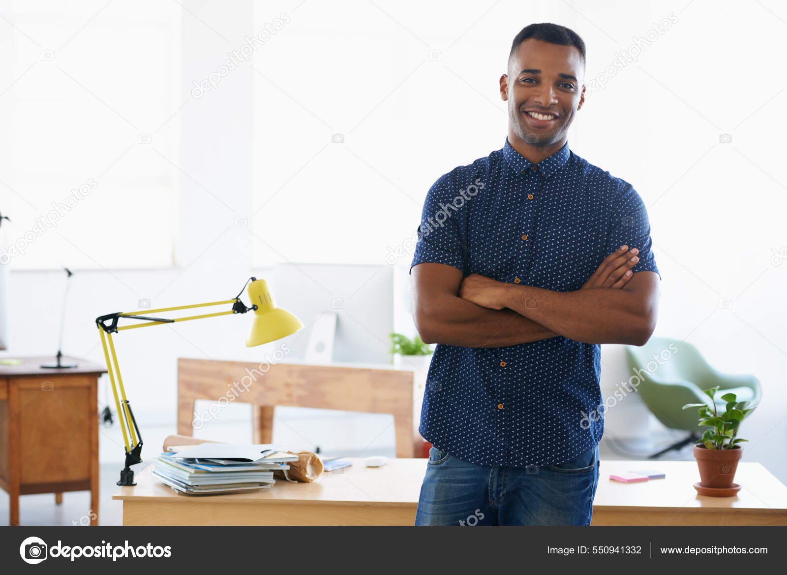 My space at the office. A young man in the office. Stock Photo by ...