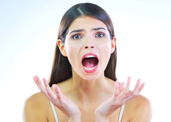 RAGE. Head and shoulders portrait of a furious woman screaming loudly ...