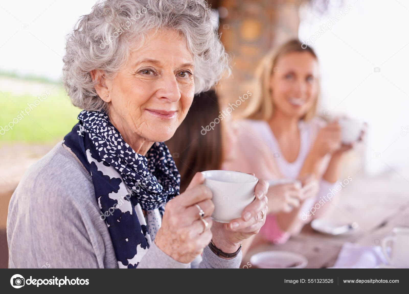 Tea revives you. Shot of three generations of the woman of the women of ...